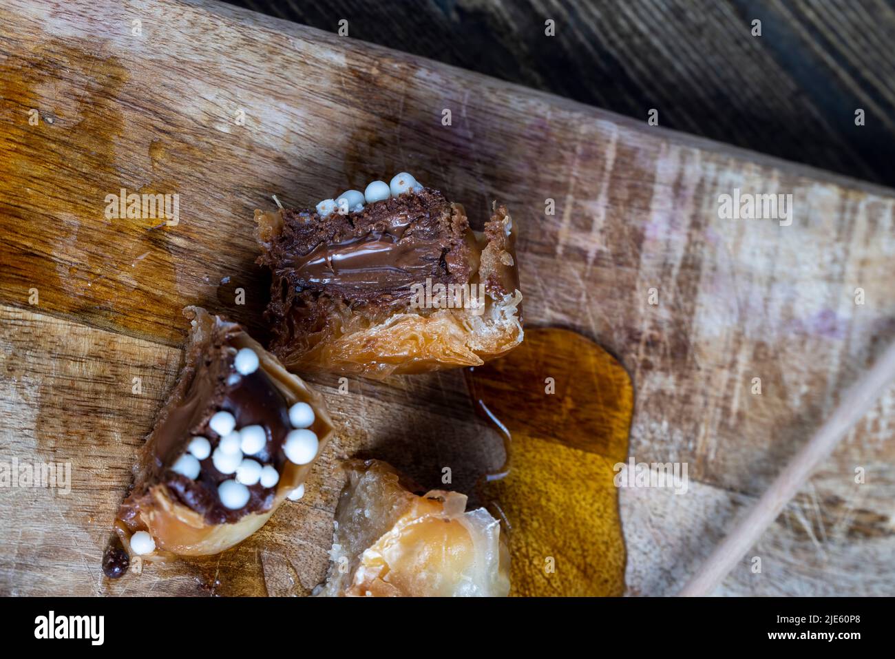 sweets made of thin puff pastry with chocolate filling and honey ...