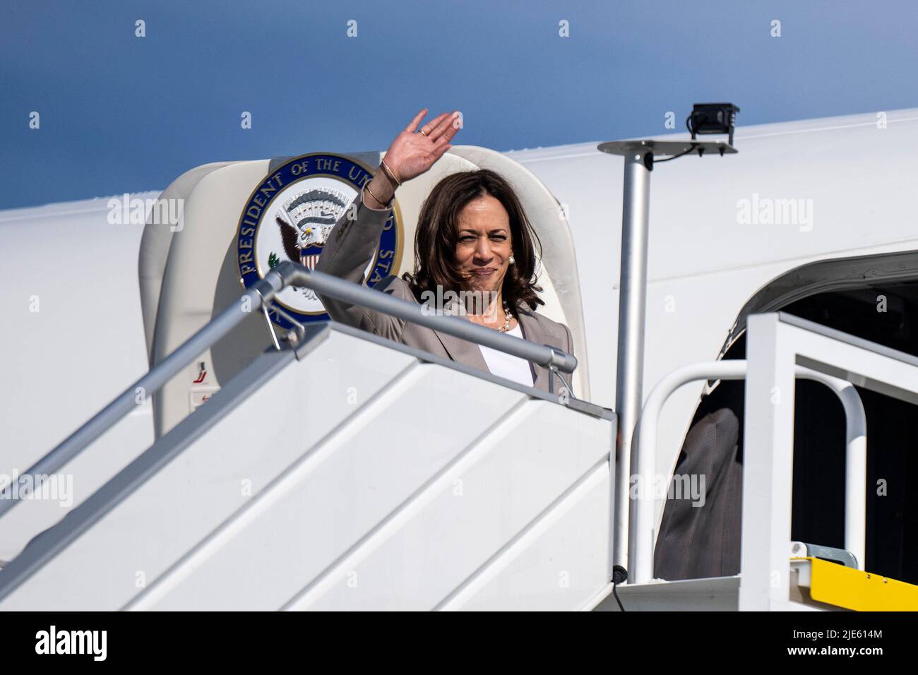 United States Vice President Kamala Harris waves from the top of the ...