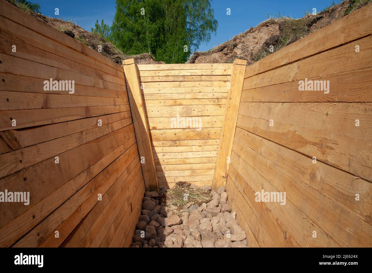 dug in the ground and reinforced with improved boards trench ...