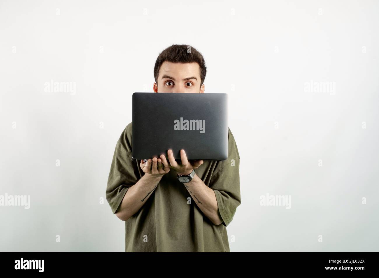 Caucasian young man wearing t-shirt posing isolated over white ...