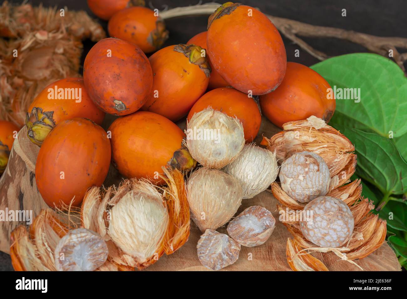 Ripe Betel nut or areca nut with betel leaf isolated on wooden ...