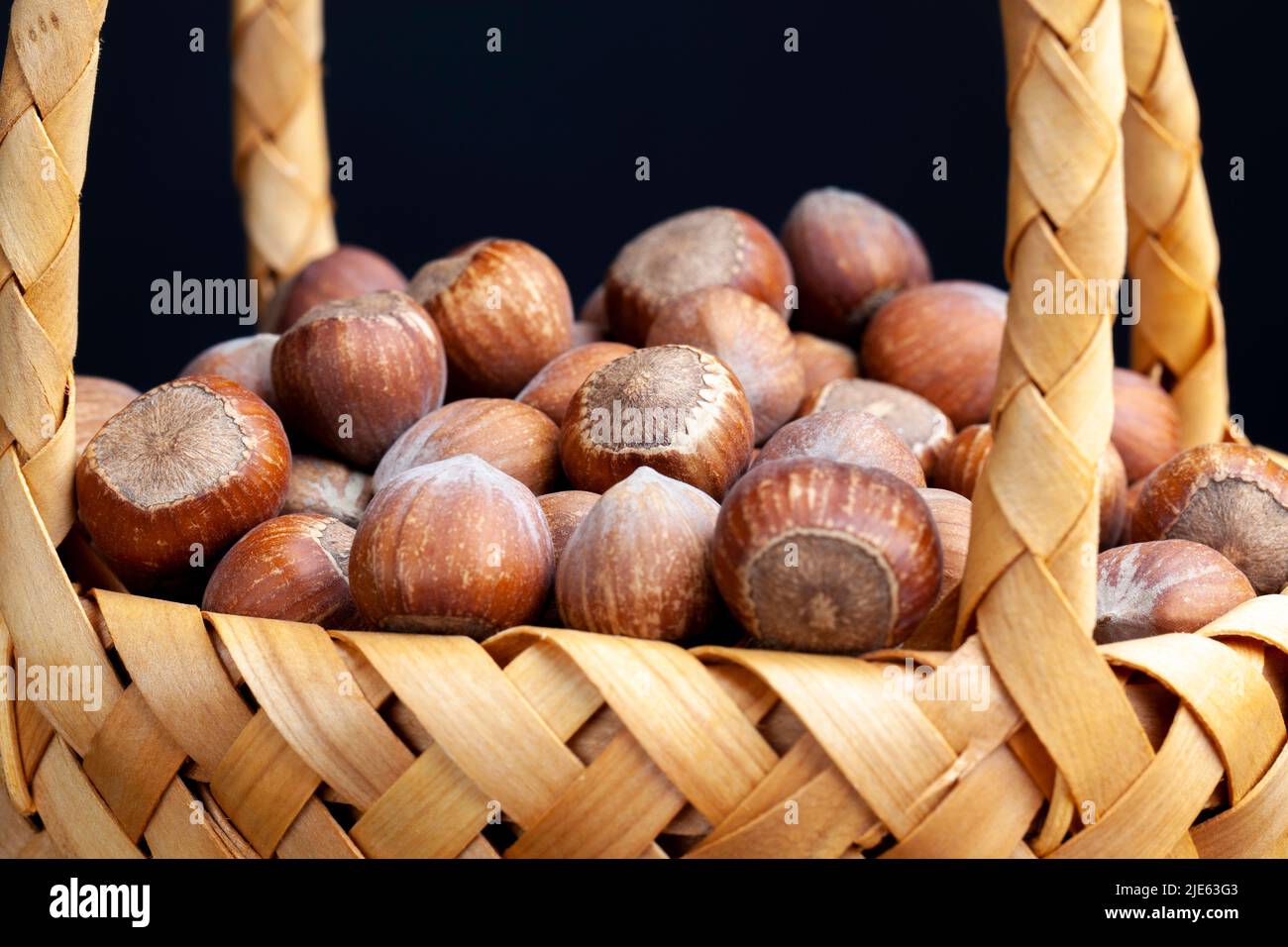 a pile of harvested hazelnuts on the table, collected a large number of ...