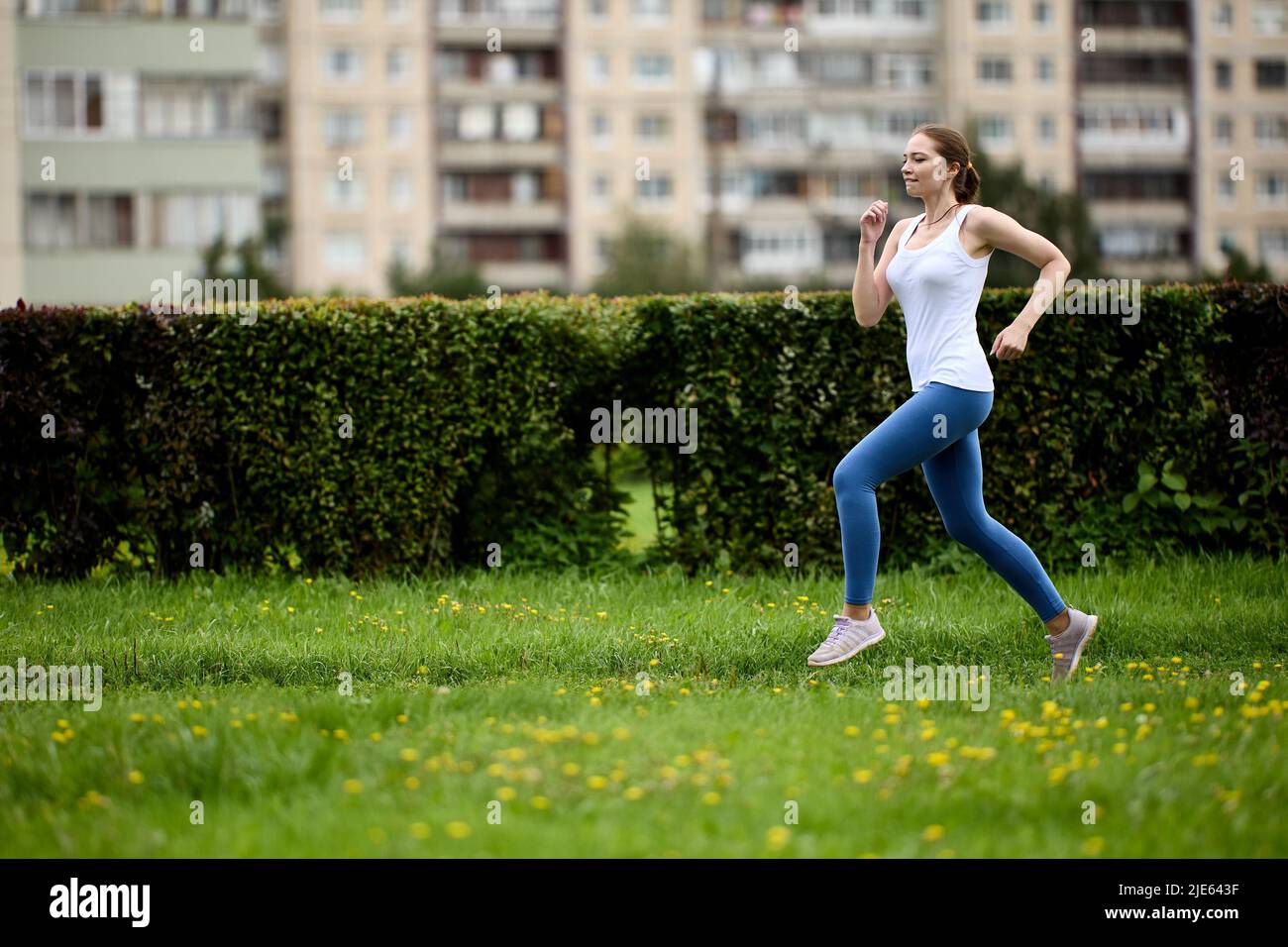 29 year old woman runs in public park Stock Photo - Alamy