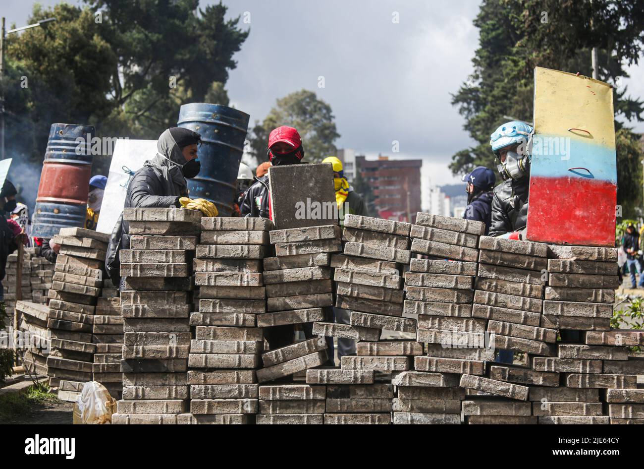 Quito, Ecuador. 24th June, 2022. Protesters take cover behind blocks ...