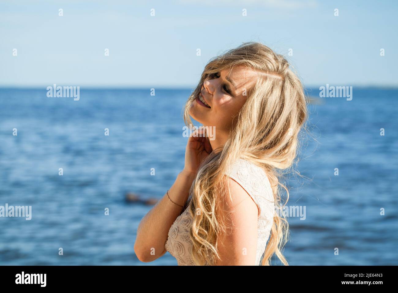 Close-up portrait of a pretty young woman in the sun Stock Photo - Alamy