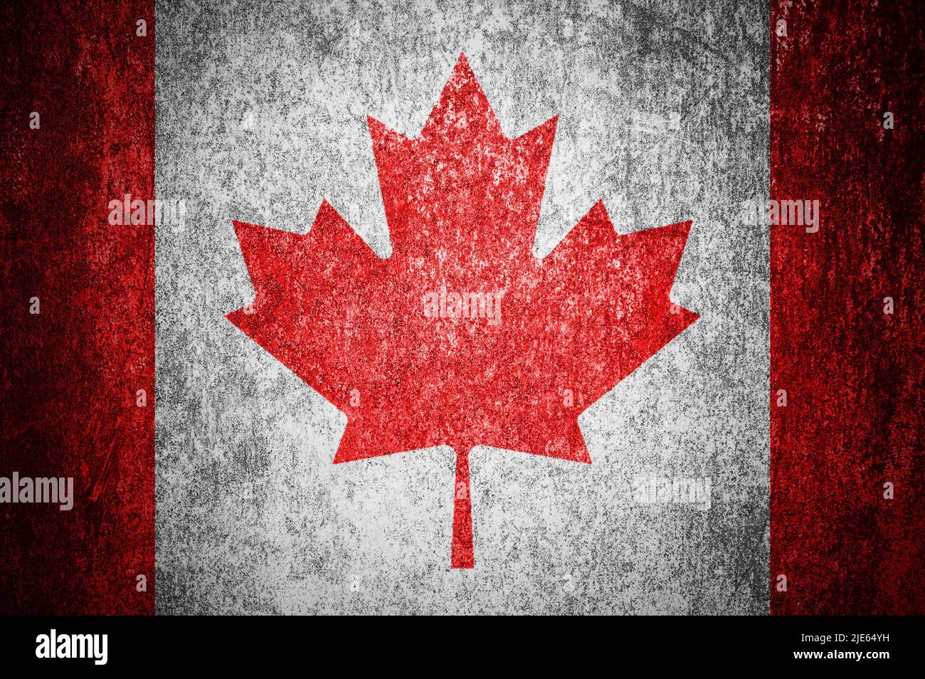 Closeup of grunge Canadian flag. Dirty Canada flag on a metal surface ...