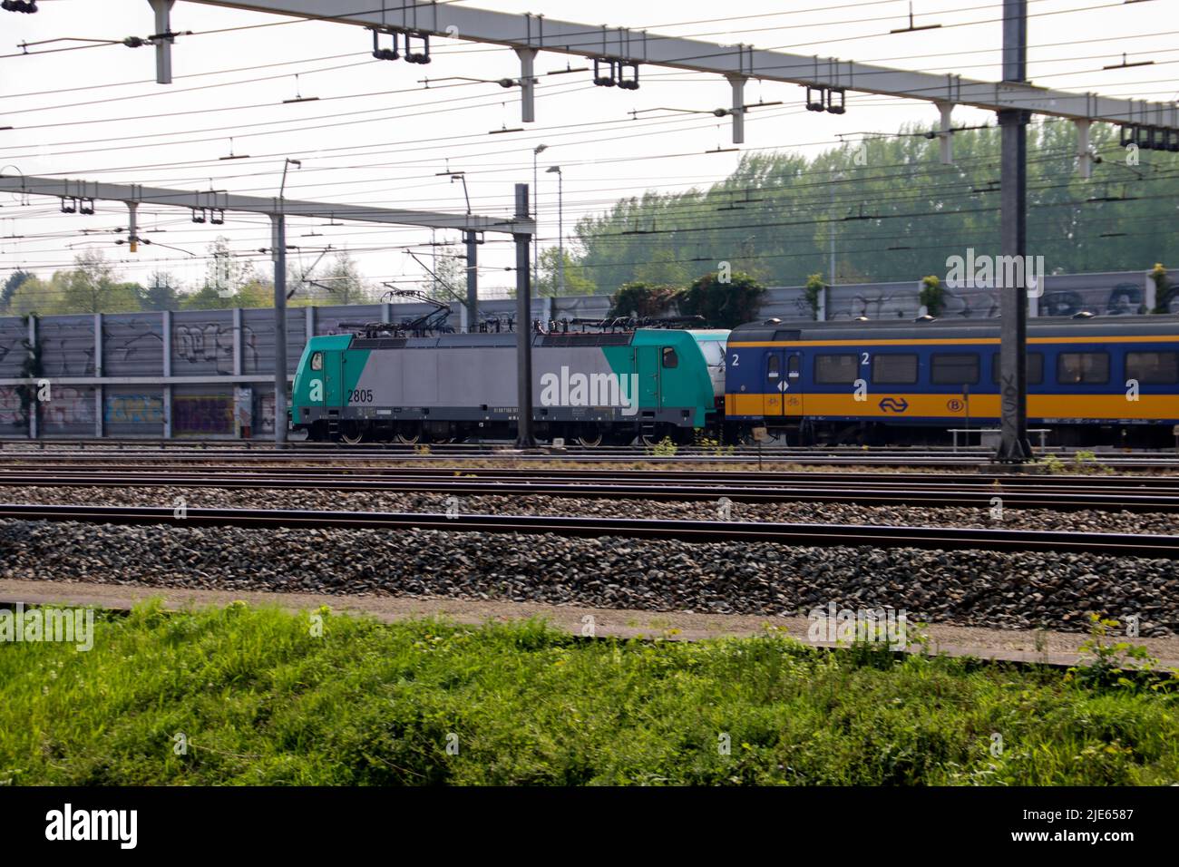 Traxx locomotive with container freight at railroad in Barendrecht in ...