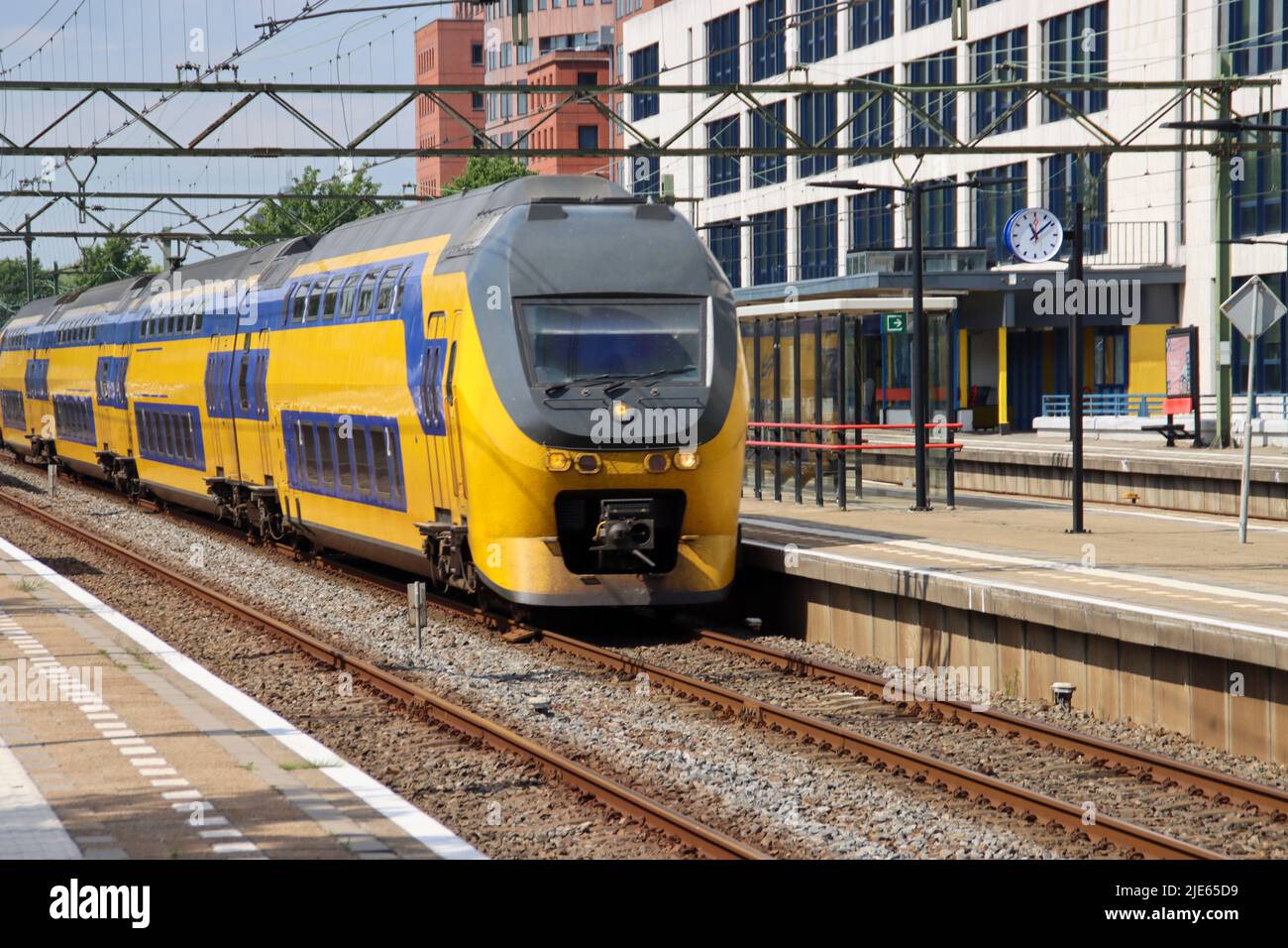 VIRM doubledeck intercity train of NS on across tation Den Haag ...