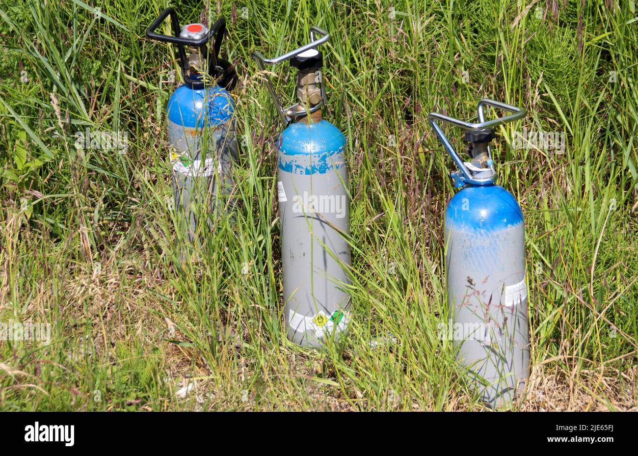 Cylinders with nitrous oxide and black balloons left in parking lot ...