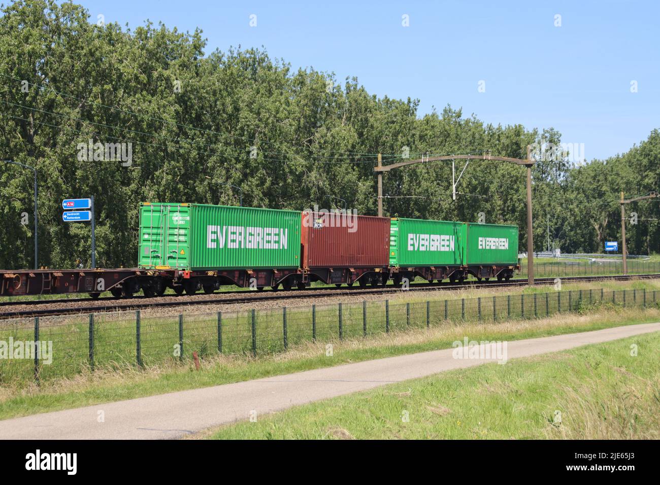 Traxx locomotive with container freight train on track close to ...