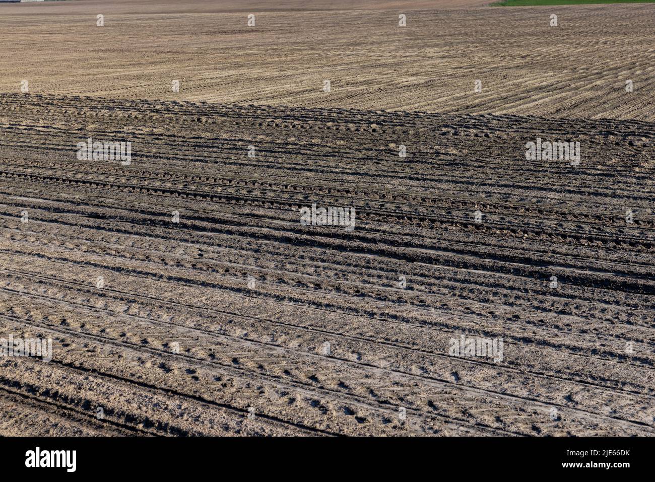 soil in an agricultural field that is being prepared to receive a new ...