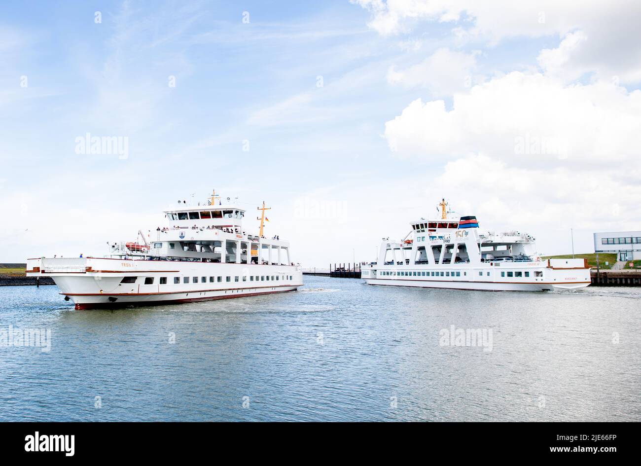 25 June 2022, Lower Saxony, Norddeich: Two ferries of AG Reederei ...