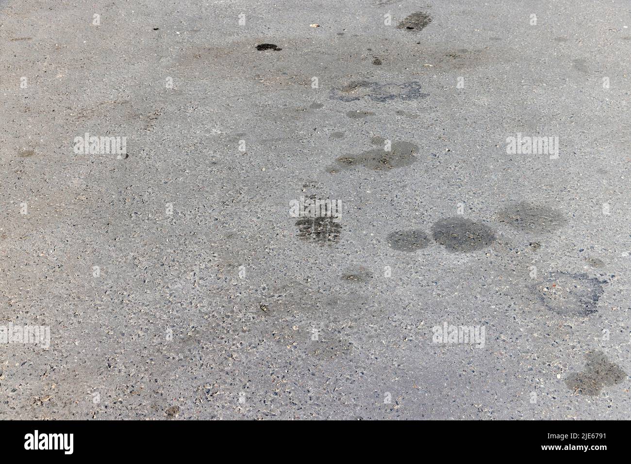 a highway with oil stains on the surface, a polluted highway from ...