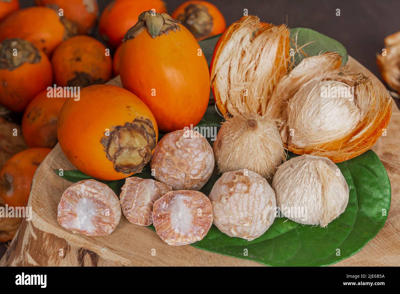 Ripe Betel nut or areca nut with betel leaf isolated on wooden ...