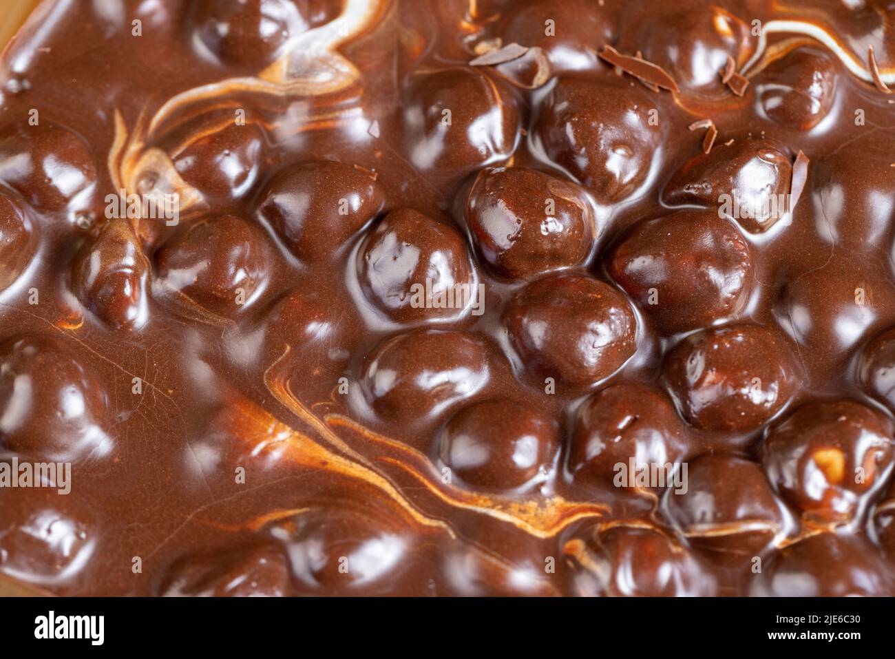 homemade chocolate with lots of hazelnuts, high-quality chocolate made ...