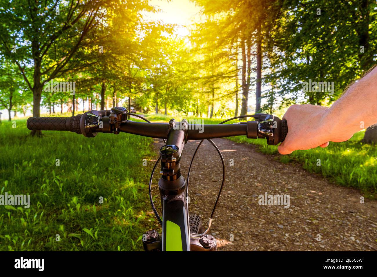 First-person view bicycle riding. Man riding a bike, holding bike ...
