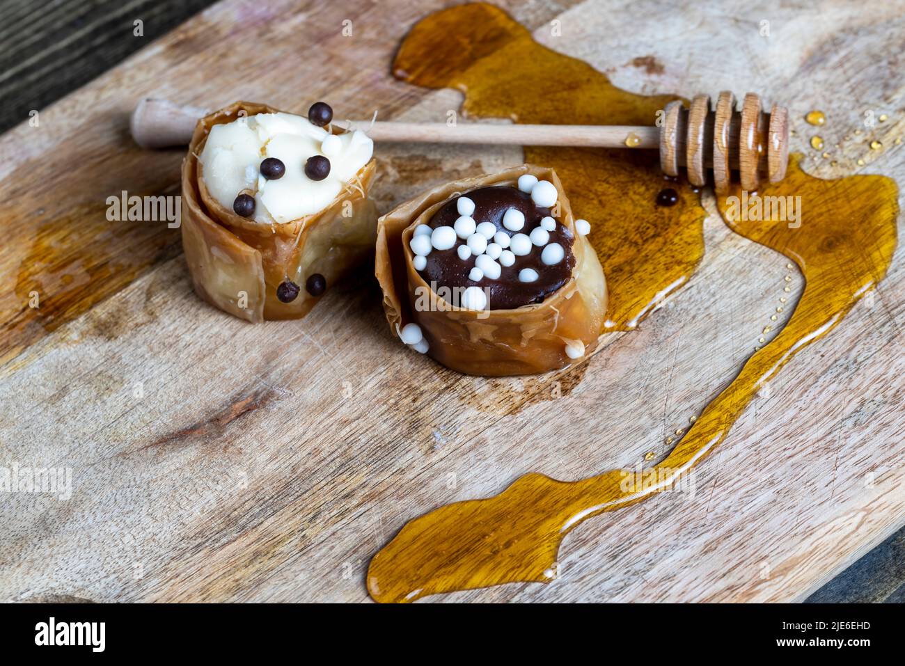 sweets made of thin puff pastry with chocolate filling and honey ...