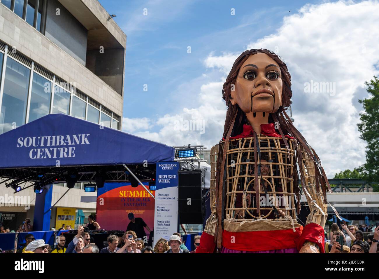 London, UK. 25 June 2022. Little Amal a giant animated puppet depicting ...