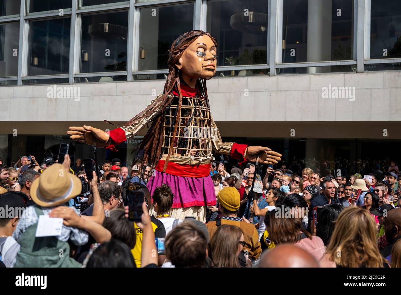 London, UK. 25 June 2022. Little Amal a giant animated puppet depicting ...