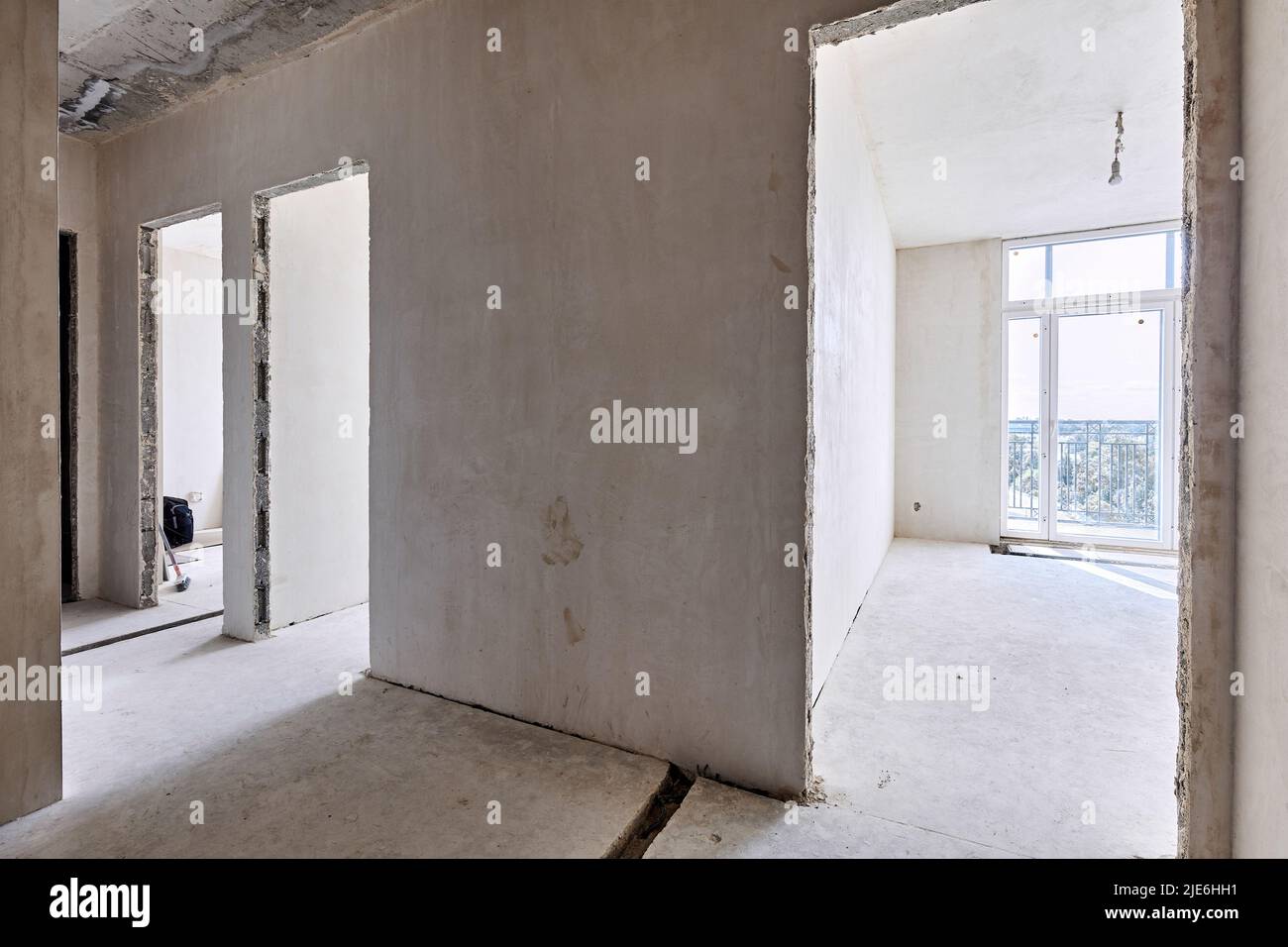 Interior of new apartment without finishing in gray tones Stock Photo ...