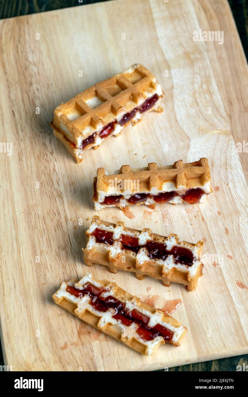 soft square waffles with strawberry jam, delicious and sweet dessert ...