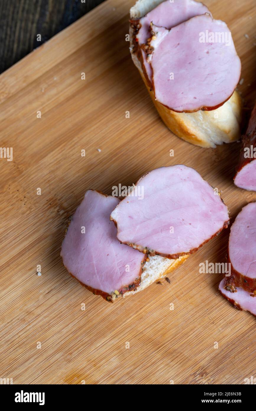 sliced boiled pork fillet meat, cooked pork fillet dish is cut into ...