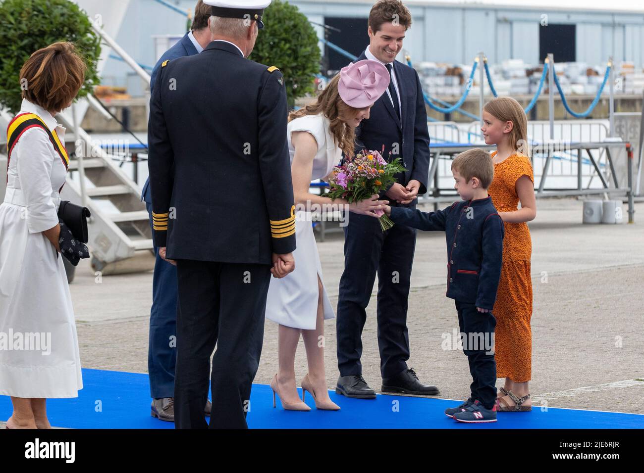 Crown Princess Elisabeth receives flowers from a young boy, as State ...