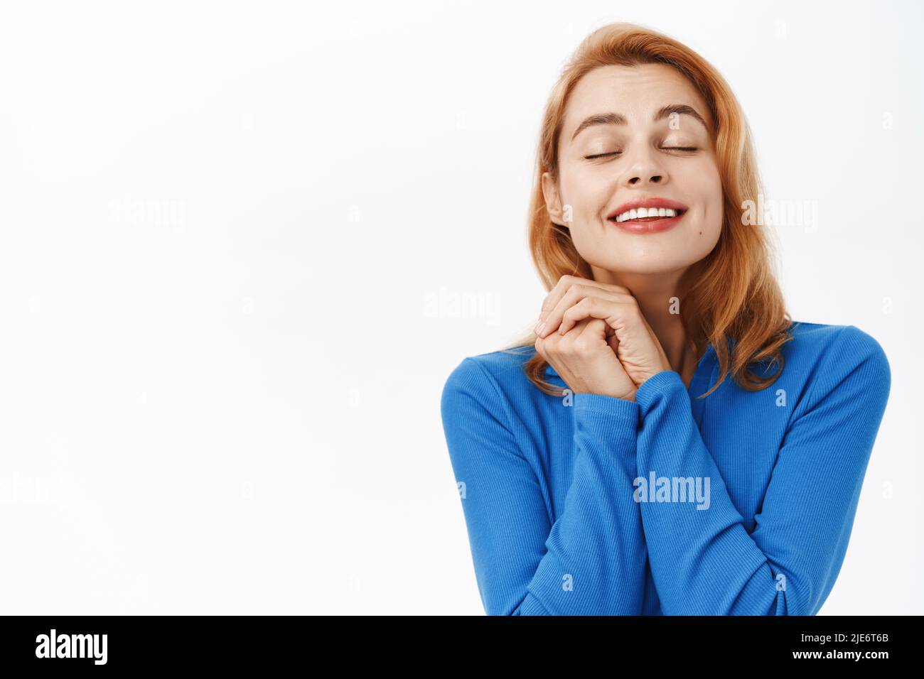 Close up portrait of happy, relieved smiling woman with closed eyes ...