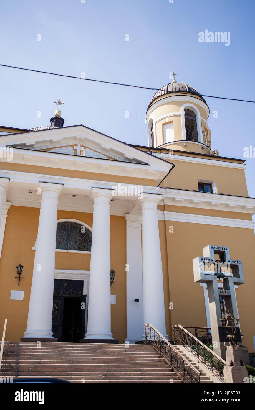 an entrance to a large catholic church with white columns Stock Photo ...