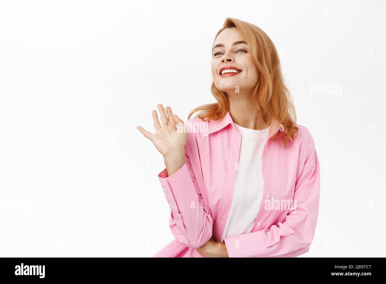 Friendly modern girl waving hand, saying hello to someone, hi gesture ...