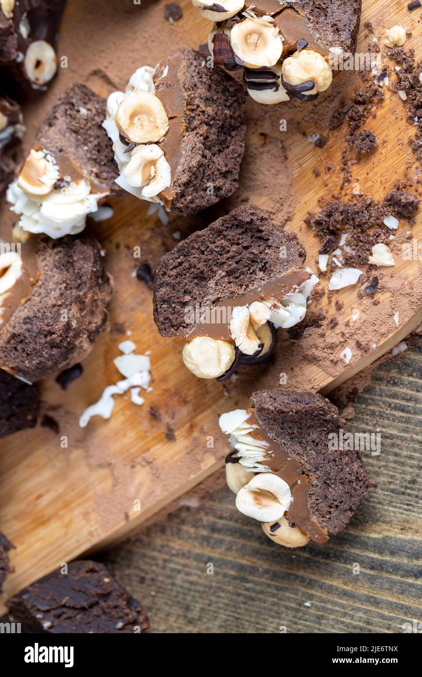 multicomponent cake made of caramel and nuts in chocolate, mixed ...