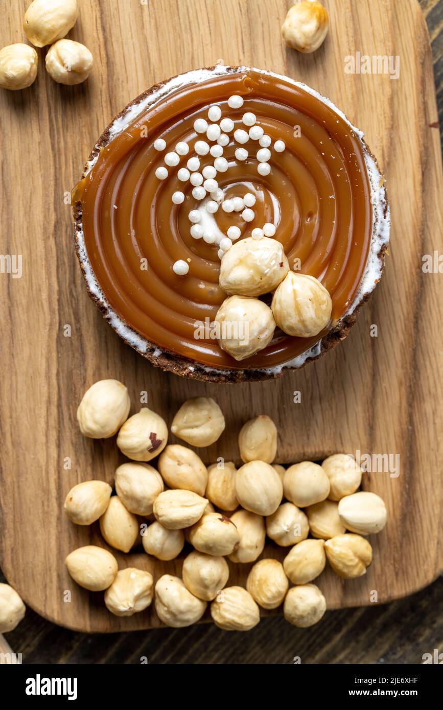 chocolate tartlet with cream filling and salted caramel with nuts ...
