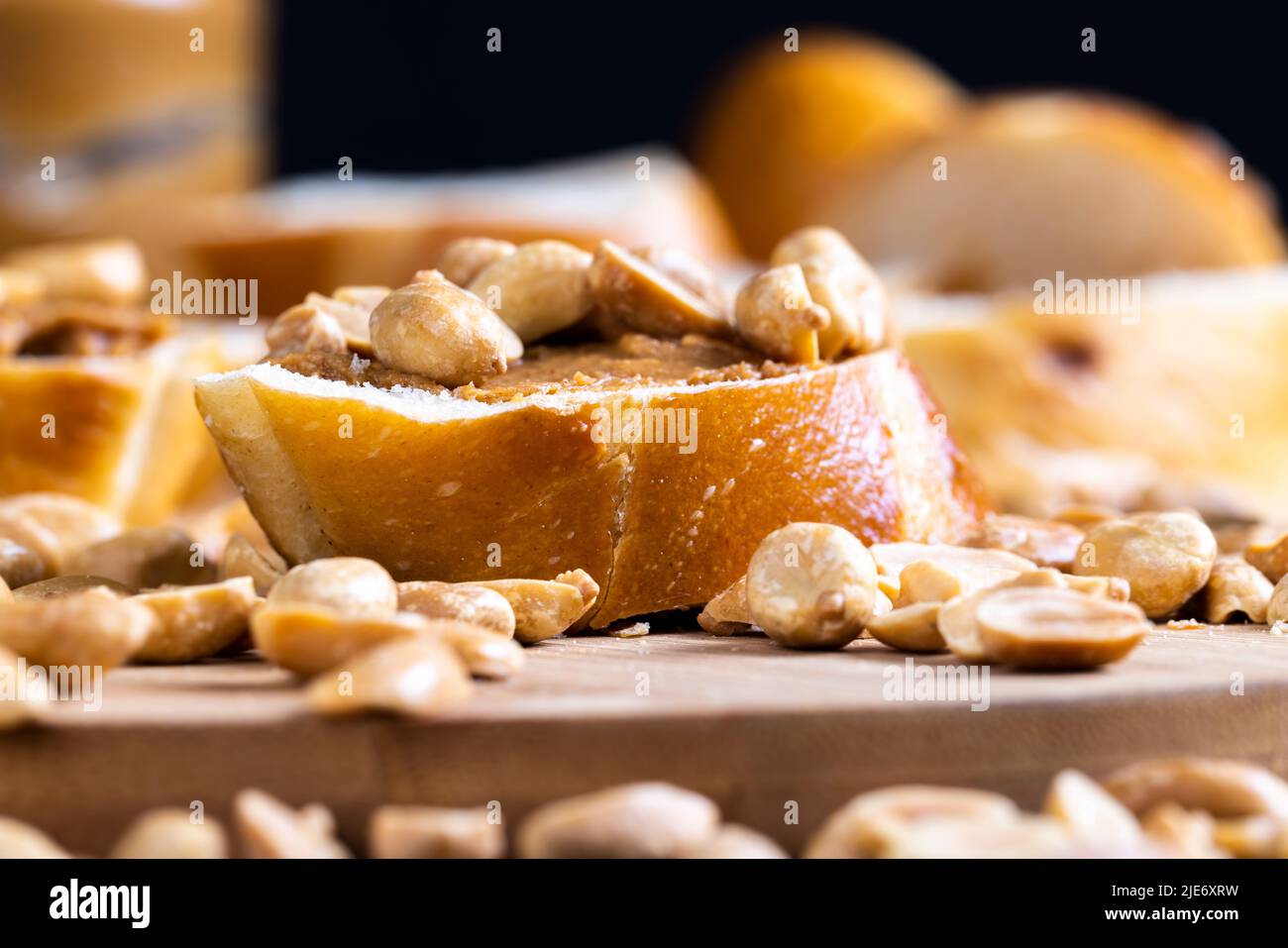 wheat fresh baguette and peanut paste, making breakfast of bread and ...