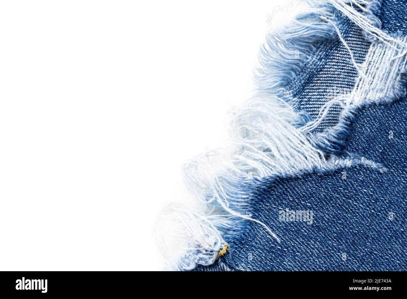 Frayed ripped jeans on a white background. Denim frame with empty space ...