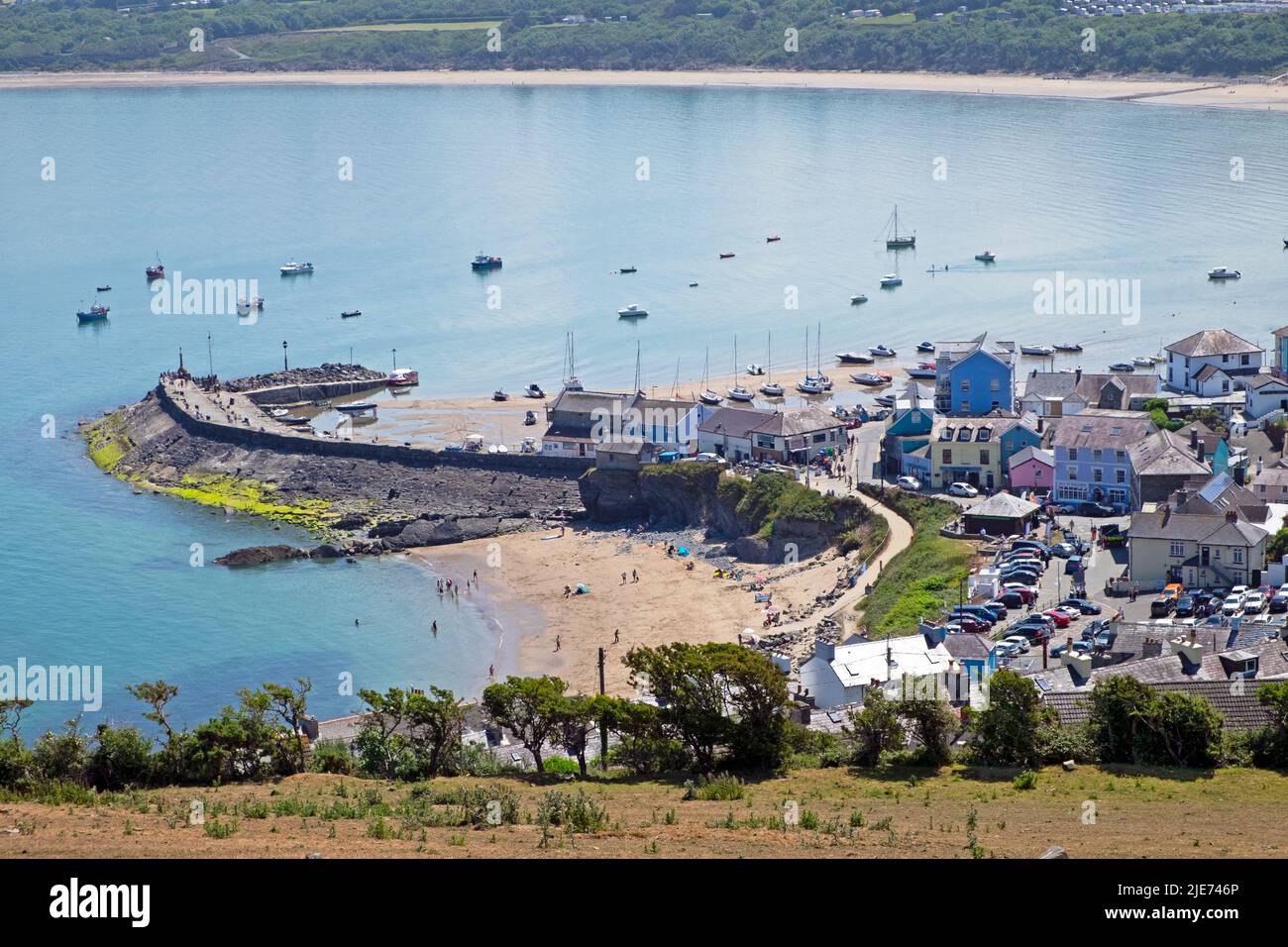 View of New Quay pier town harbour beach on the Ceredigion coast in ...