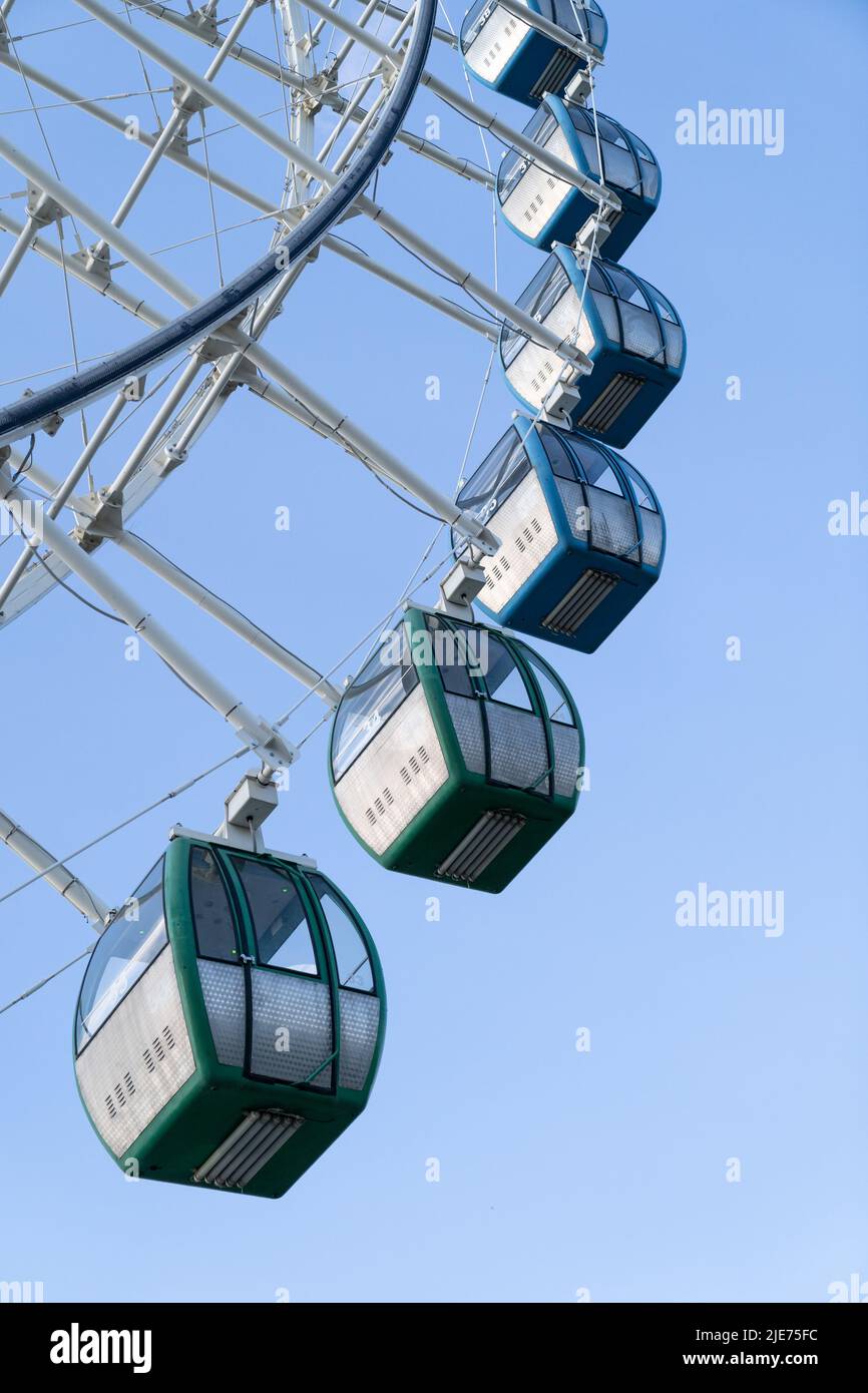 Closeup of colorful cabins of giant ferris wheel in amusement park ...