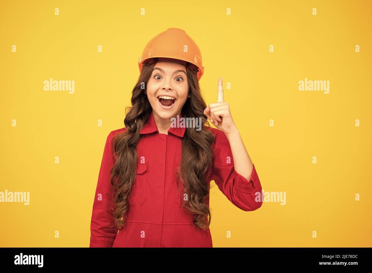 happy teenager girl in safety hard hat inspired with idea, inspiration ...