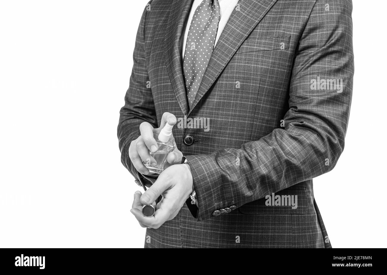 Pure luxury in bottle. Businessman apply perfume on wrist. Personal ...