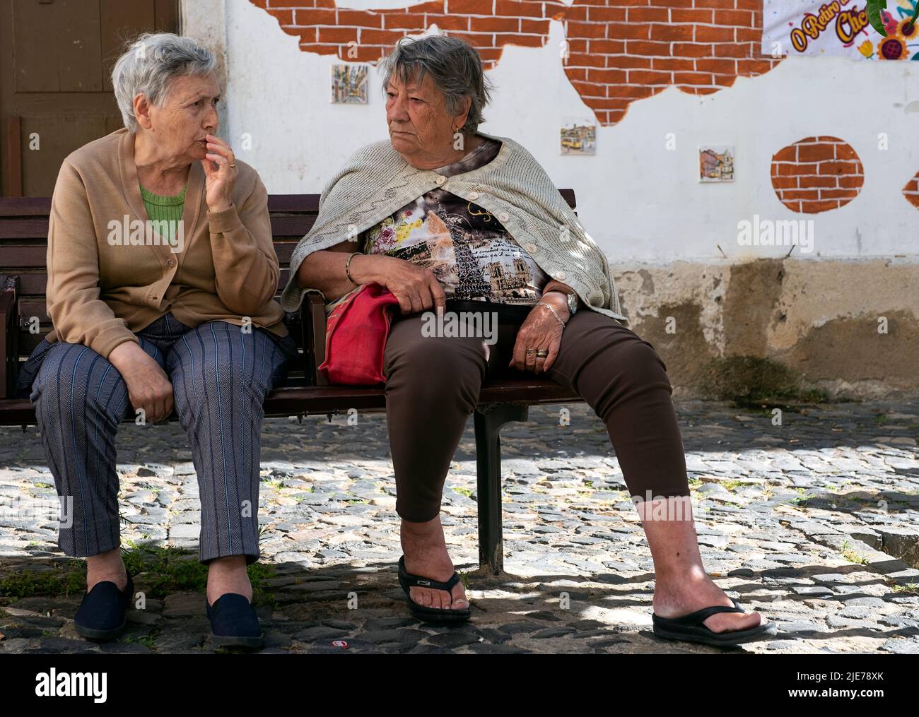 elderly women talking on park bench in Lisbon, Portugal Stock Photo - Alamy