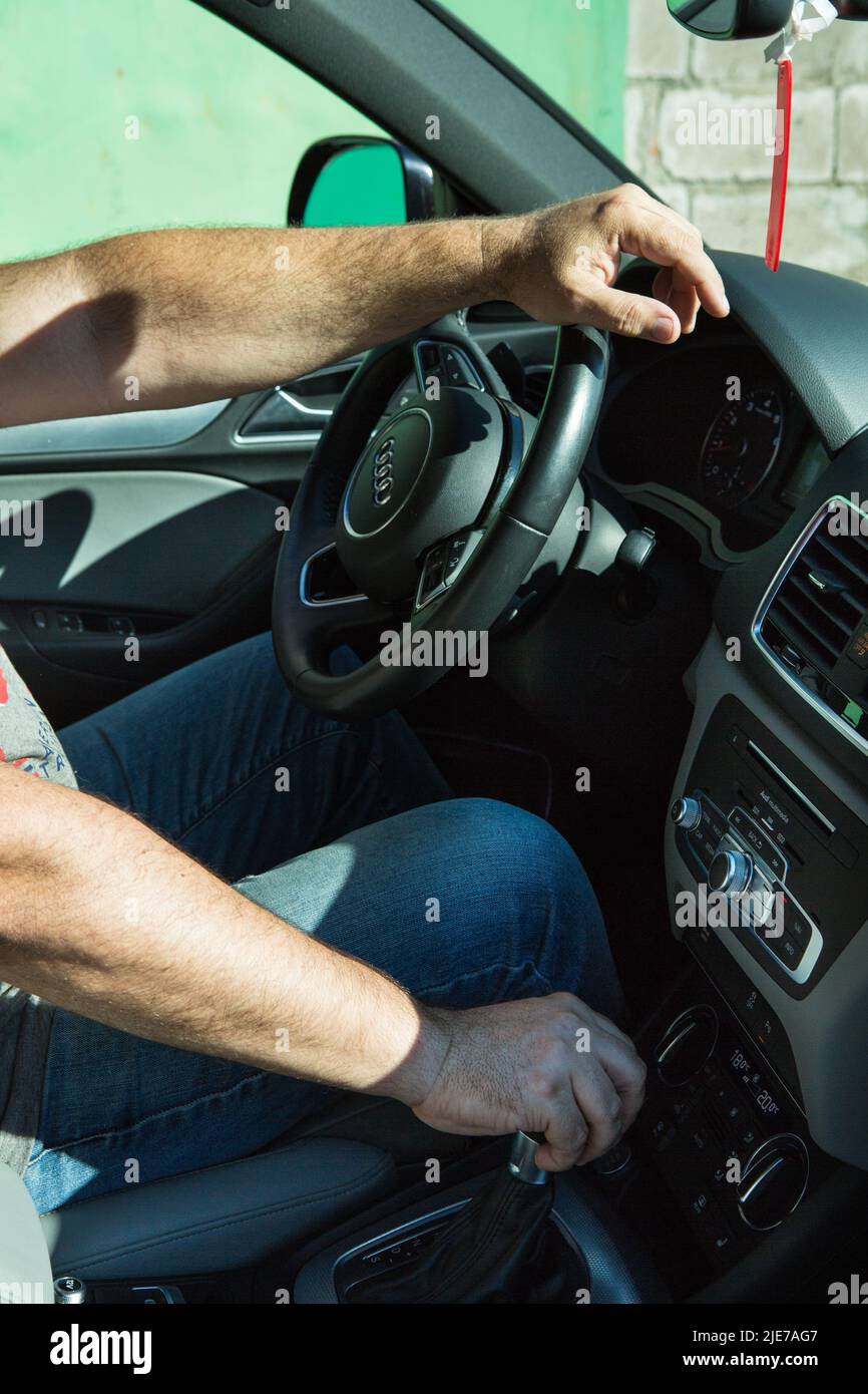 Dnepropetrovsk, Ukraine - 06.08.2022: A man driving an Audi Q3 car in ...