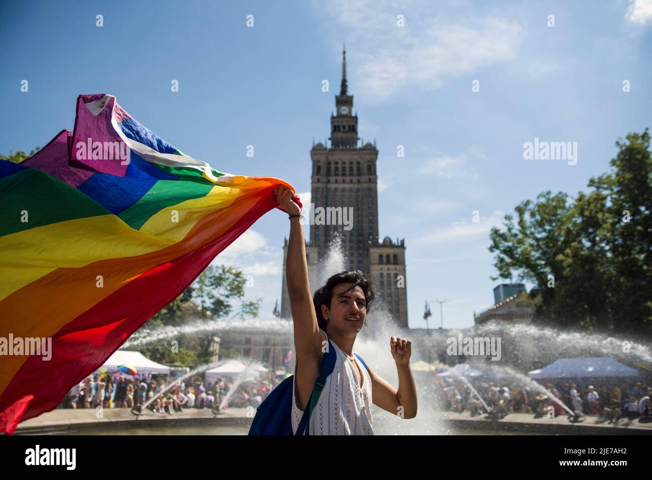 Warsaw, Poland. 25th June, 2022. A participant waves a rainbow flag ...