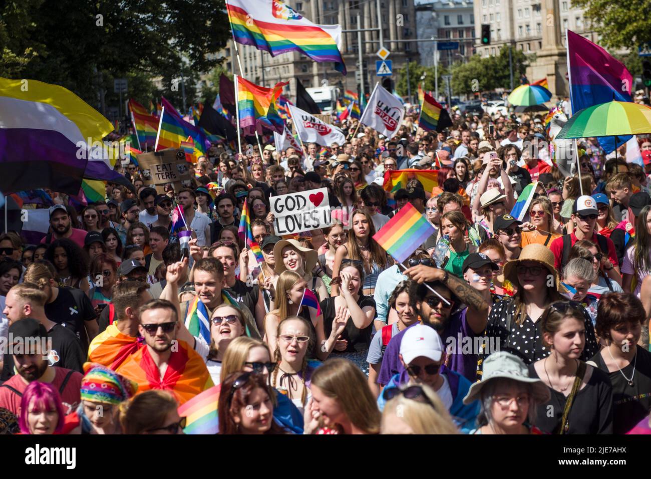 Warsaw, Poland. 25th June, 2022. People hold rainbow flags and placards ...
