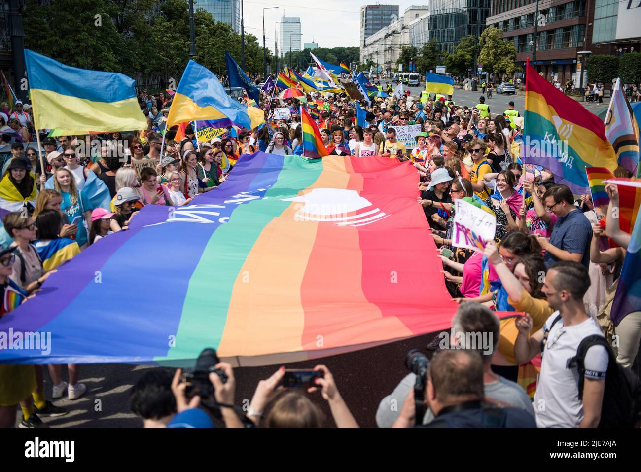 Warsaw, Poland. 25th June, 2022. People hold rainbow and Ukrainian ...