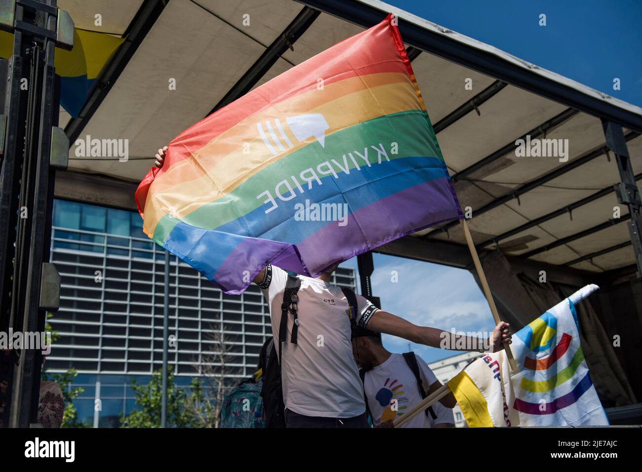 Warsaw, Poland. 25th June, 2022. A man waves a Kyiv Pride rainbow flag ...