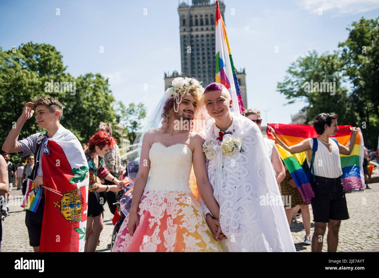 A gay couple wearing wedding dresses pose during the Warsaw Pride. The ...