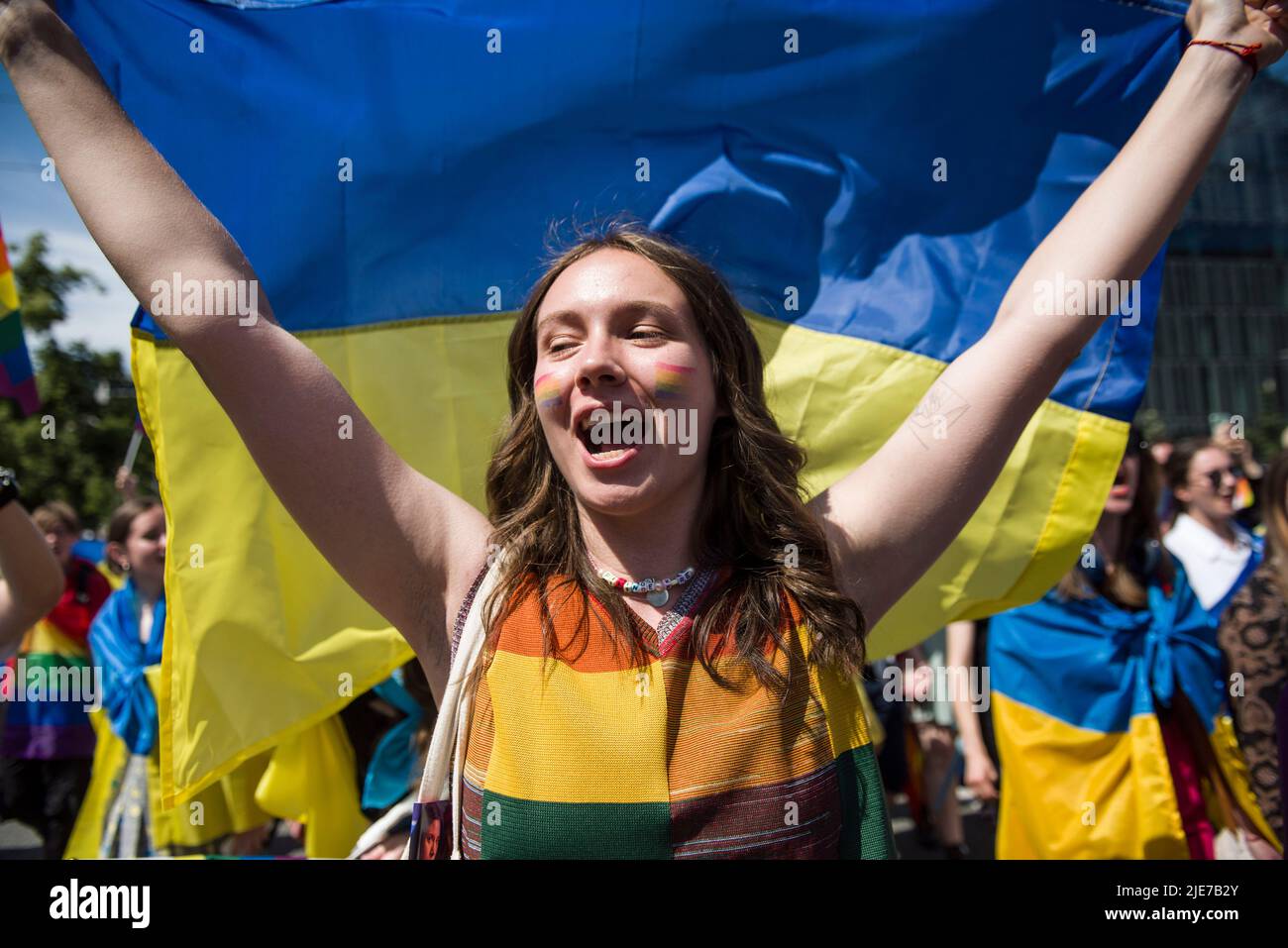 A woman shouts slogans while holding a Ukrainian flag during the Warsaw Pride. The Kyiv Pride ...
