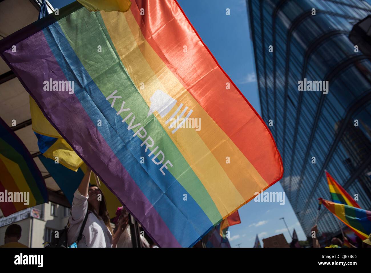 People hold rainbow flags during the Warsaw Pride. The Kyiv Pride ...