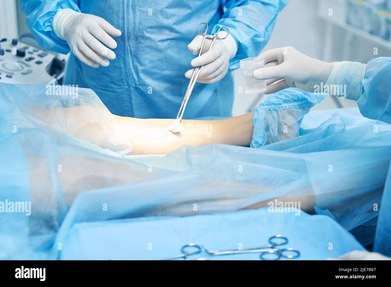 Sanitizing leg skin surface for surgical operation in hospital Stock ...