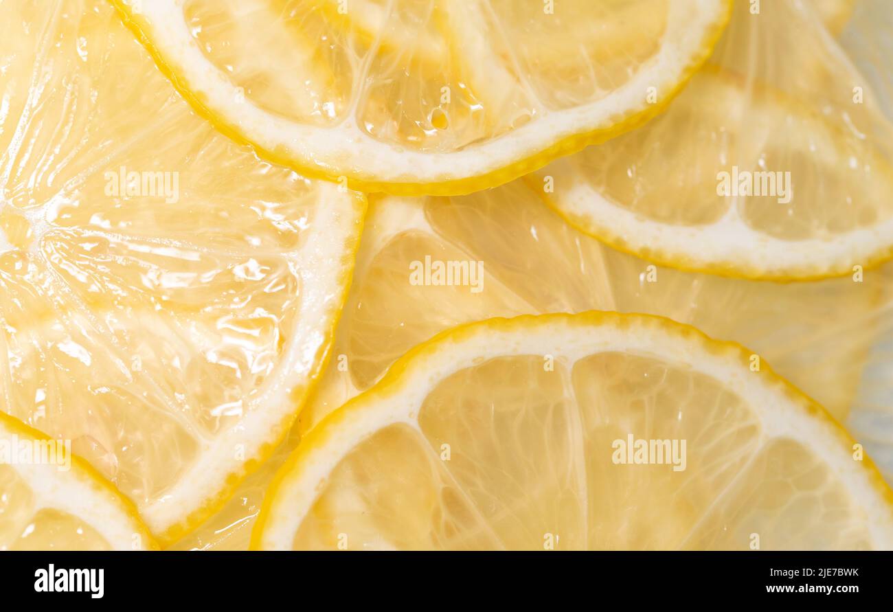 Lemon thin slices filling the entire space, stacked on top of each ...