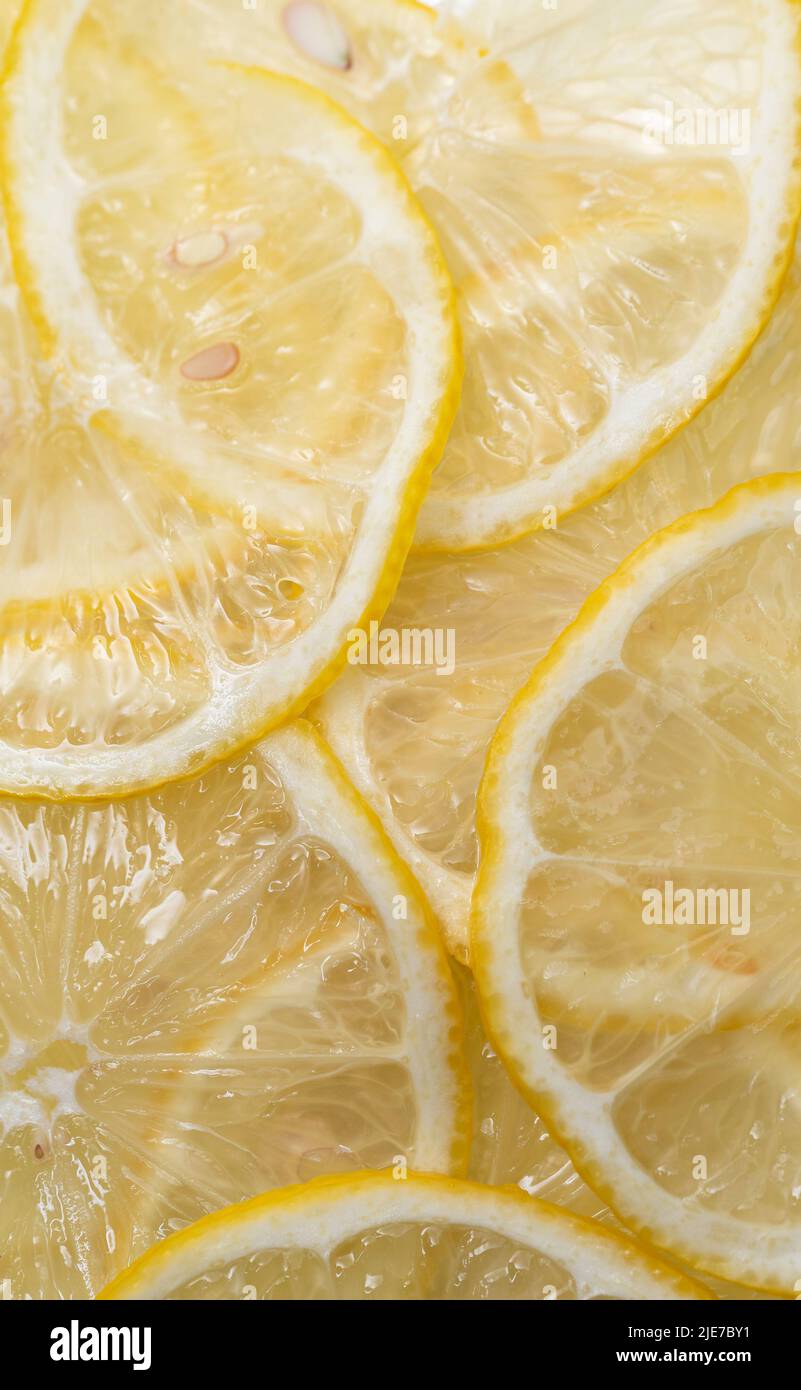 Lemon thin slices filling the entire space, stacked on top of each ...